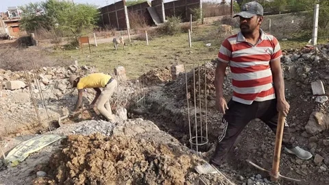 Construction Labour Team Digging a pile ... | Stock Video | Pond5