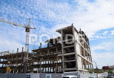 Construction of multi storey residential buildings. Tower cranes at a ...