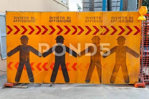 Photograph: Construction site border with warning signs #135926432