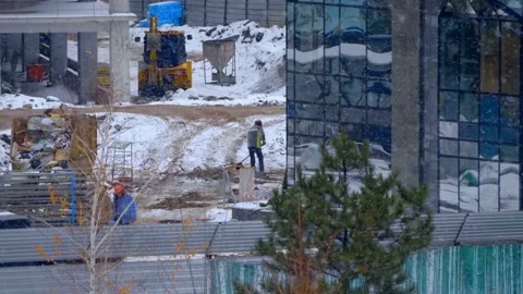 Construction site in winter in snowfall,... | Stock Video | Pond5