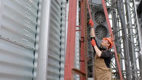 Construction Worker Using Chain Hoist in... | Stock Video | Pond5