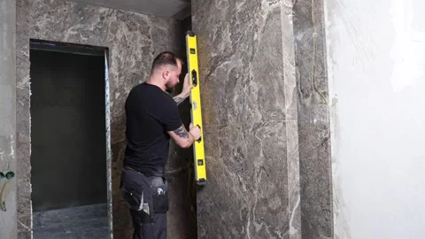 Construction worker using spirit level i... | Stock Video | Pond5