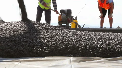 Construction workers compacting liquid c... | Stock Video | Pond5