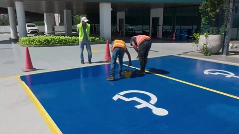 Construction workers refresh a disabled ... | Stock Video | Pond5