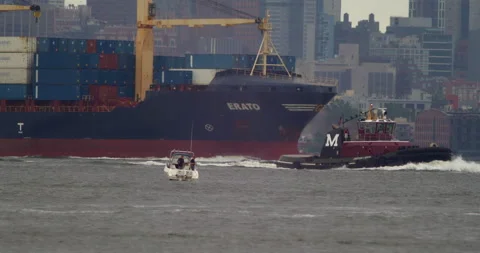 Container Cargo ship ERATO escorted by t... | Stock Video | Pond5