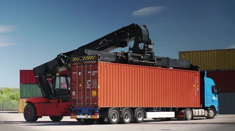 Container Handler loading a Truck in Por... | Stock Video | Pond5