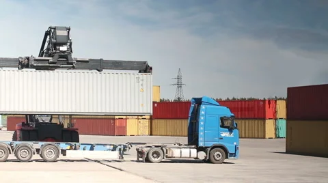 Container Handler unloading a Truck in P... | Stock Video | Pond5