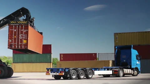Container Handler unloading a Truck in P... | Stock Video | Pond5