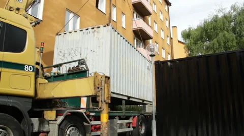 Container lifted off truck lorry at buil... | Stock Video | Pond5