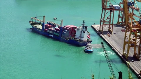 A container ship docking in a port | Stock Video | Pond5