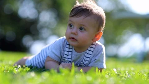 Contemplative baby child lost in thought... | Stock Video | Pond5
