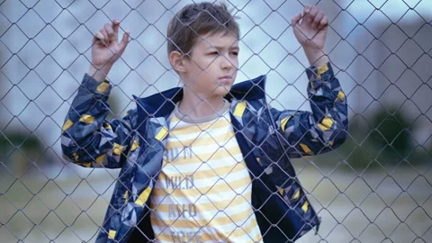 Contemplative Pause: Reflective Boy Gath... | Stock Video | Pond5