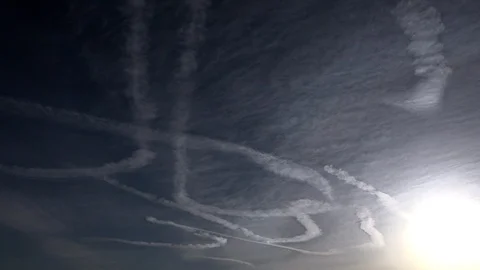 Contrail Bands Loop Curl Swirl Across Bl... | Stock Video | Pond5