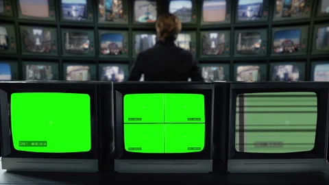 Control Room Man Watching CCTV Monitors ... | Stock Video | Pond5