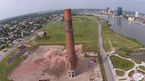 Controlled demolition of smokestack, exp... | Stock Video | Pond5