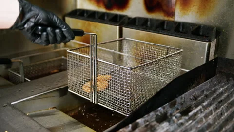 Controlling The Cooking Of Oil Fried Oni... | Stock Video | Pond5
