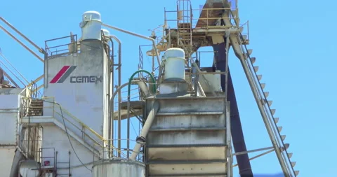 Conveyor belt pouring concrete into mixe... | Stock Video | Pond5