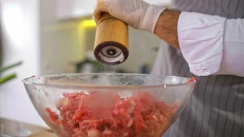 The cook adding the spices in a bowl wit... | Stock Video | Pond5