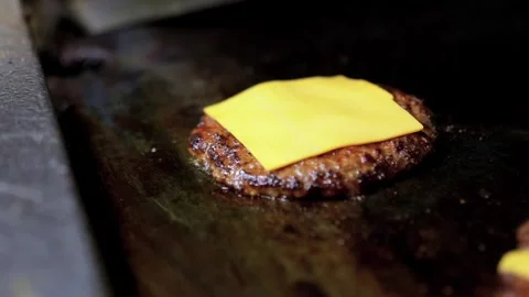 Cook Adds Cheese to Beef Patties for Bur... | Stock Video | Pond5