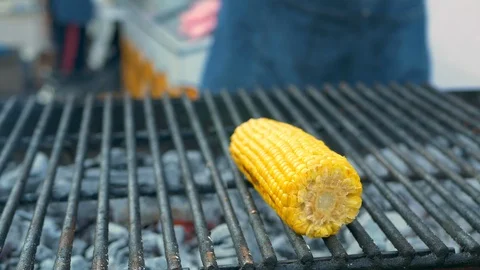 Cook fries grilled sweet corn at a stree... | Stock Video | Pond5