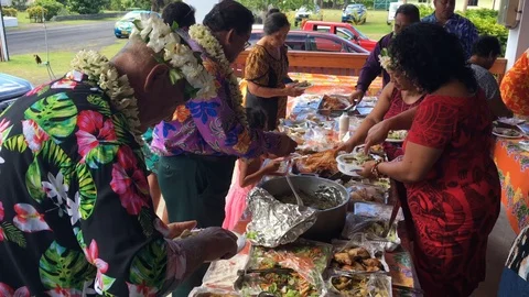 Cook Islanders people eat traditional fo... | Stock Video | Pond5