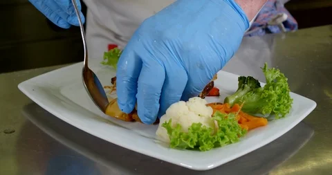 cook is serving meal in restaurant kitch... | Stock Video | Pond5
