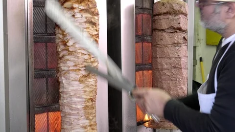 a cook slices doner kebab at the famous ... | Stock Video | Pond5