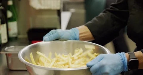 Cook turning fries to degrease in indust... | Stock Video | Pond5