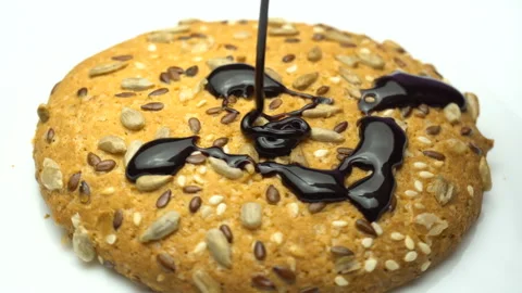 Cookie rotating on white plate and pouri... | Stock Video | Pond5