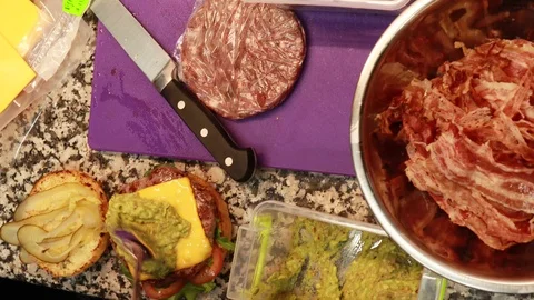 Cooking burgers in the kitchen. Chief co... | Stock Video | Pond5