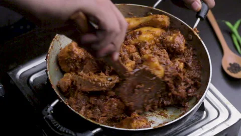 cooking chicken curry in indian style by... | Stock Video | Pond5