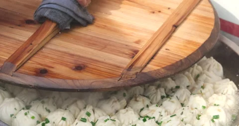 cooking Chinese shengjian bao (pan-fried... | Stock Video | Pond5