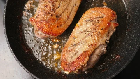 Cooking duck breast fillet on frying pan... | Stock Video | Pond5