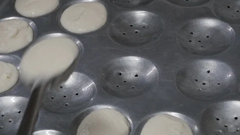 Cooking an Indian dish Idli. Ready-made ... | Stock Video | Pond5