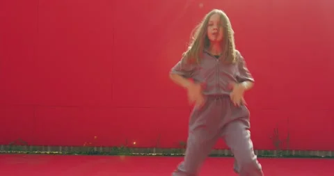 Cool beautiful teen girl dancing outdoor... | Stock Video | Pond5