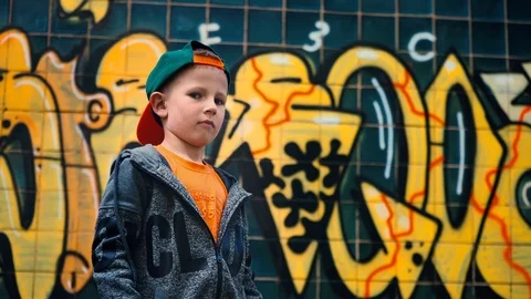 Cool boy with a serious face posing on c... | Stock Video | Pond5