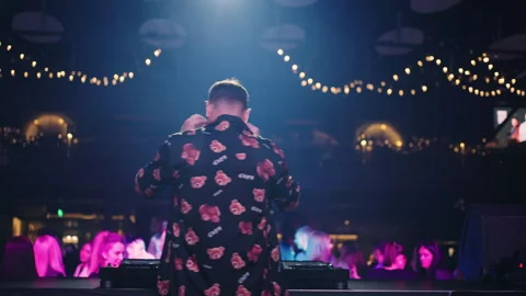 Cool DJ Mixing Tracks, Playing Techno Mu... | Stock Video | Pond5