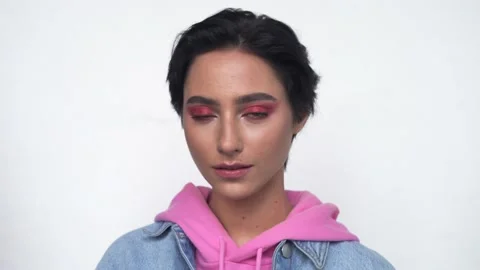 Cool gen z teen girl looking at camera o... | Stock Video | Pond5