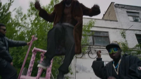 Cool Rapper in Fur Coat Doing Footwork D... | Stock Video | Pond5