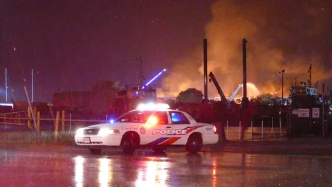 Cop car parking on the road with large f... | Stock Video | Pond5