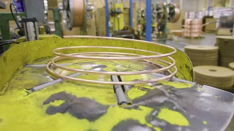 Copper tubing coming out of coil machine | Stock Video | Pond5