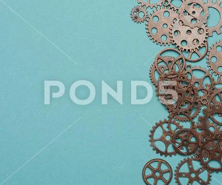 Copper various cogs on a blue background ~ Hi Res #141914143