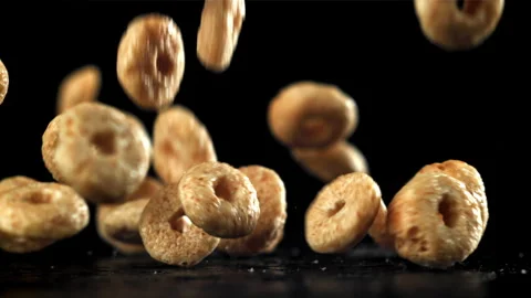 Corn flakes falling on black background.... | Stock Video | Pond5