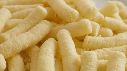 Corn flips puffs unhealthy food backgrou... | Stock Video | Pond5