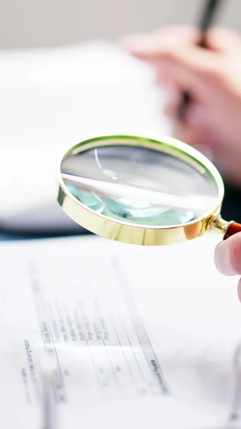 Corporate Auditor Using Magnifying Glass | Stock Video | Pond5