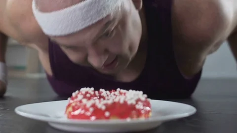 Corpulent person lying on the floor and ... | Stock Video | Pond5