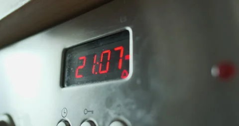 Countdown timer on the front of the oven... | Stock Video | Pond5