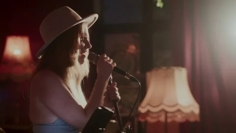 A country singer on the stage holding a ... | Stock Video | Pond5