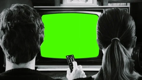Couple Changing Channels Old TV Green Sc... | Stock Video | Pond5