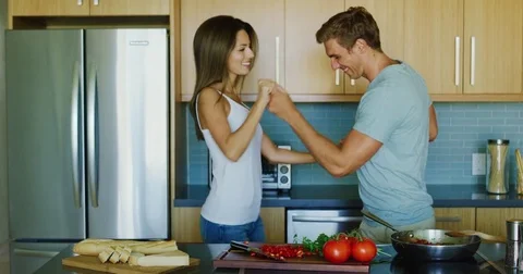 Couple Cooking and Dancing in Kitchen | Stock Video | Pond5